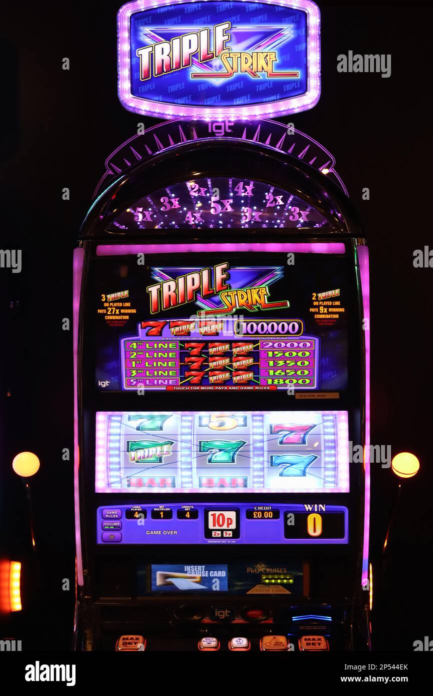 A Triple Strike slot machine illuminated in the Monte Carlo casino ...