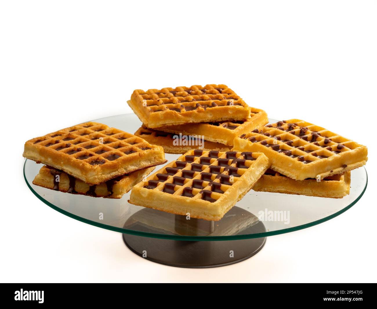 Chocolate waffles on a glass tray isolated on a white background ...
