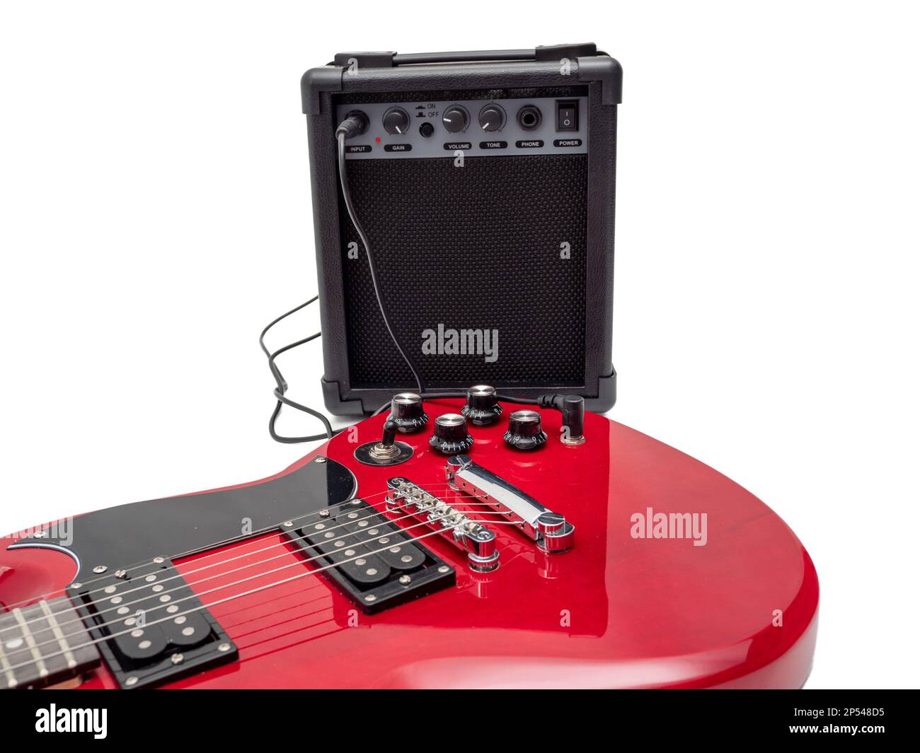 Red electric guitar and classic amplifier. Musical instrument guitar ...