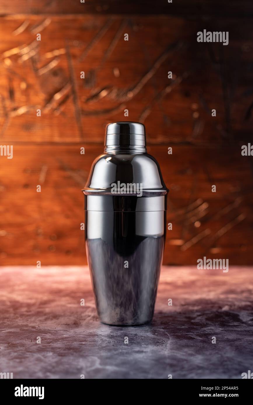 Iron shaker on oak background. Shaker for mixing cocktails Stock Photo ...