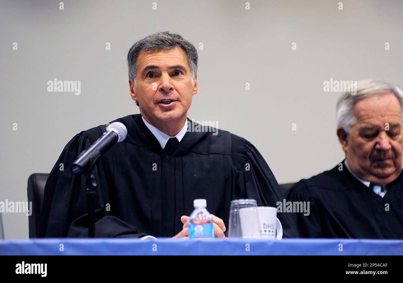 Pennsylvania Superior Court presiding Judge Jack Panella, left, offers ...