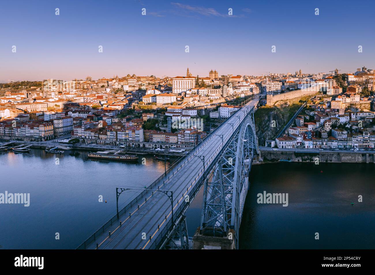 A breathtaking view of the iconic city bridge at sunrise Stock Photo ...