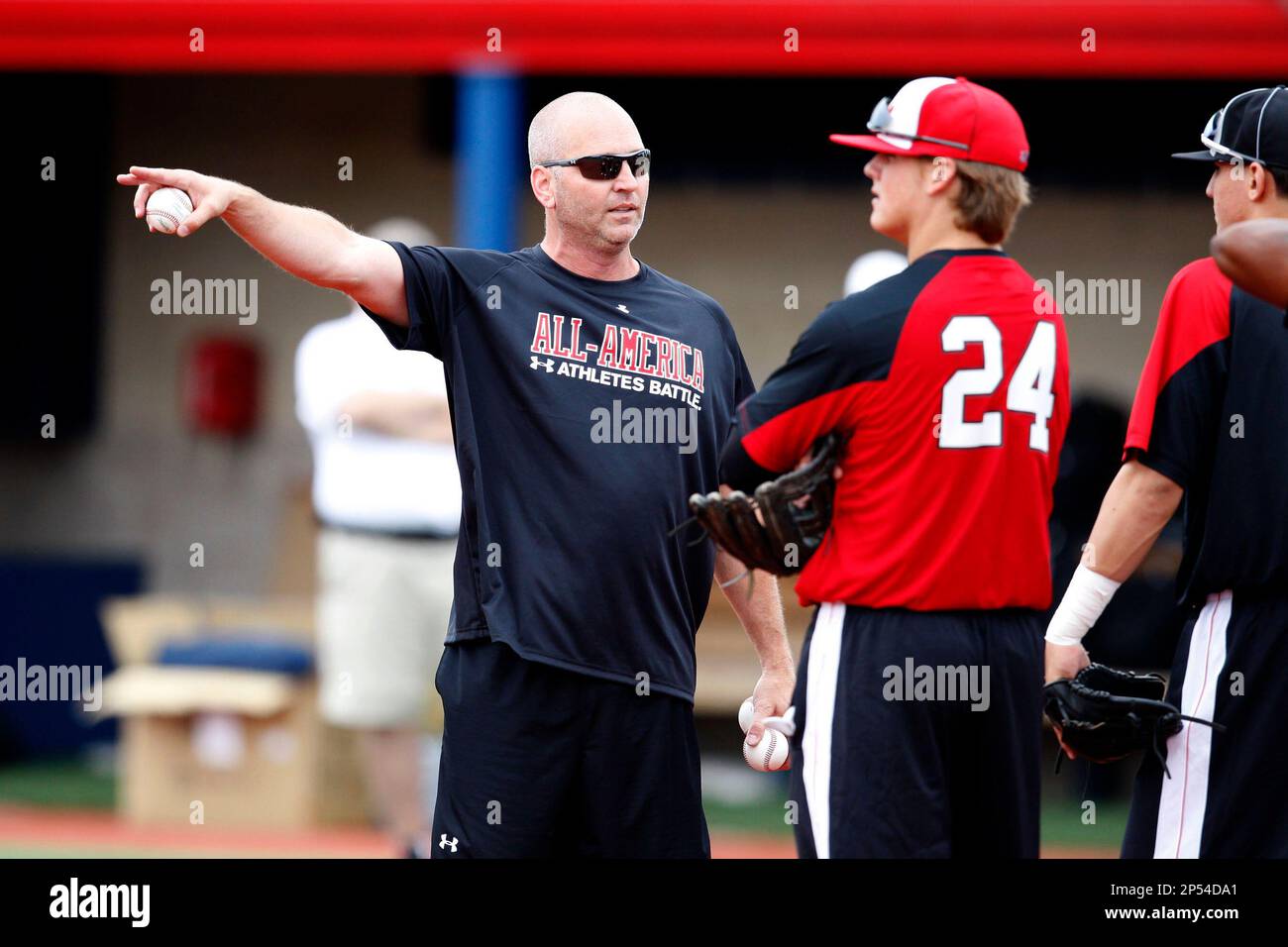 August 7, 2009: Billy Ripken instructs Stetson Allie and others while ...