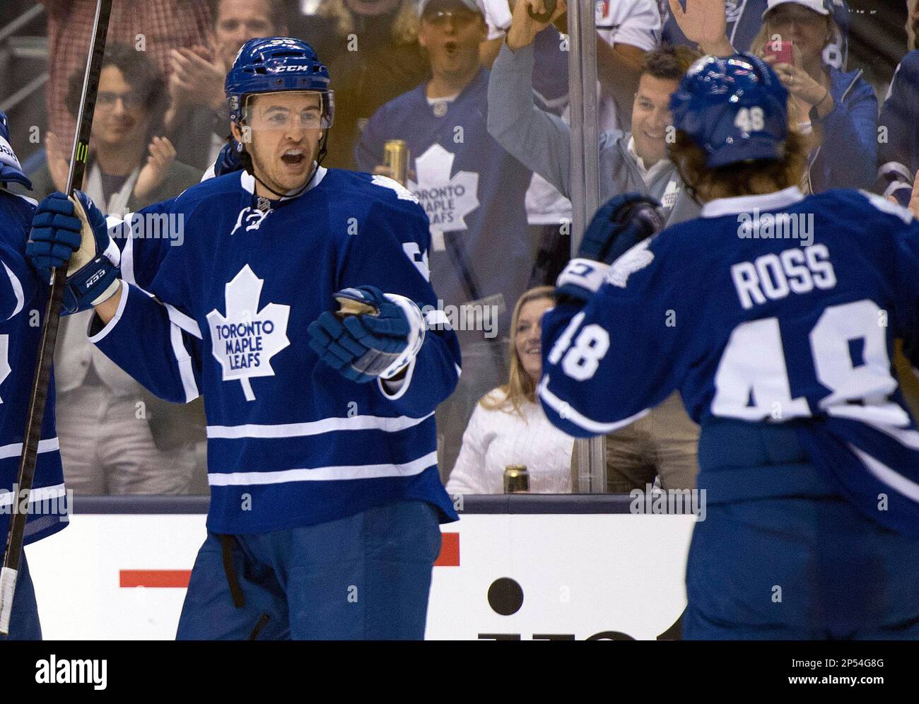 Toronto Maple Leafs Jamie Devane (59) is congratulated by teammate Brad ...