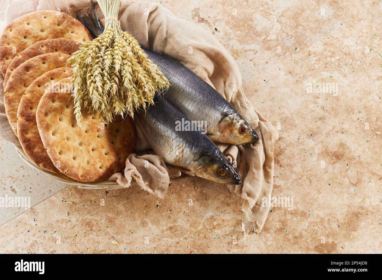 Catholic still life of five loaves of bread and two fish Stock Photo ...