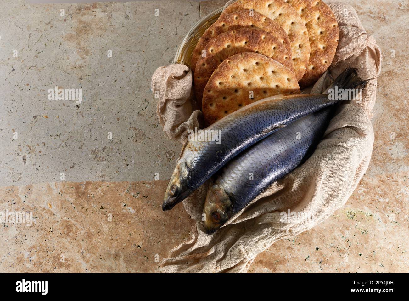 Catholic still life of five loaves of bread and two fish Stock Photo ...