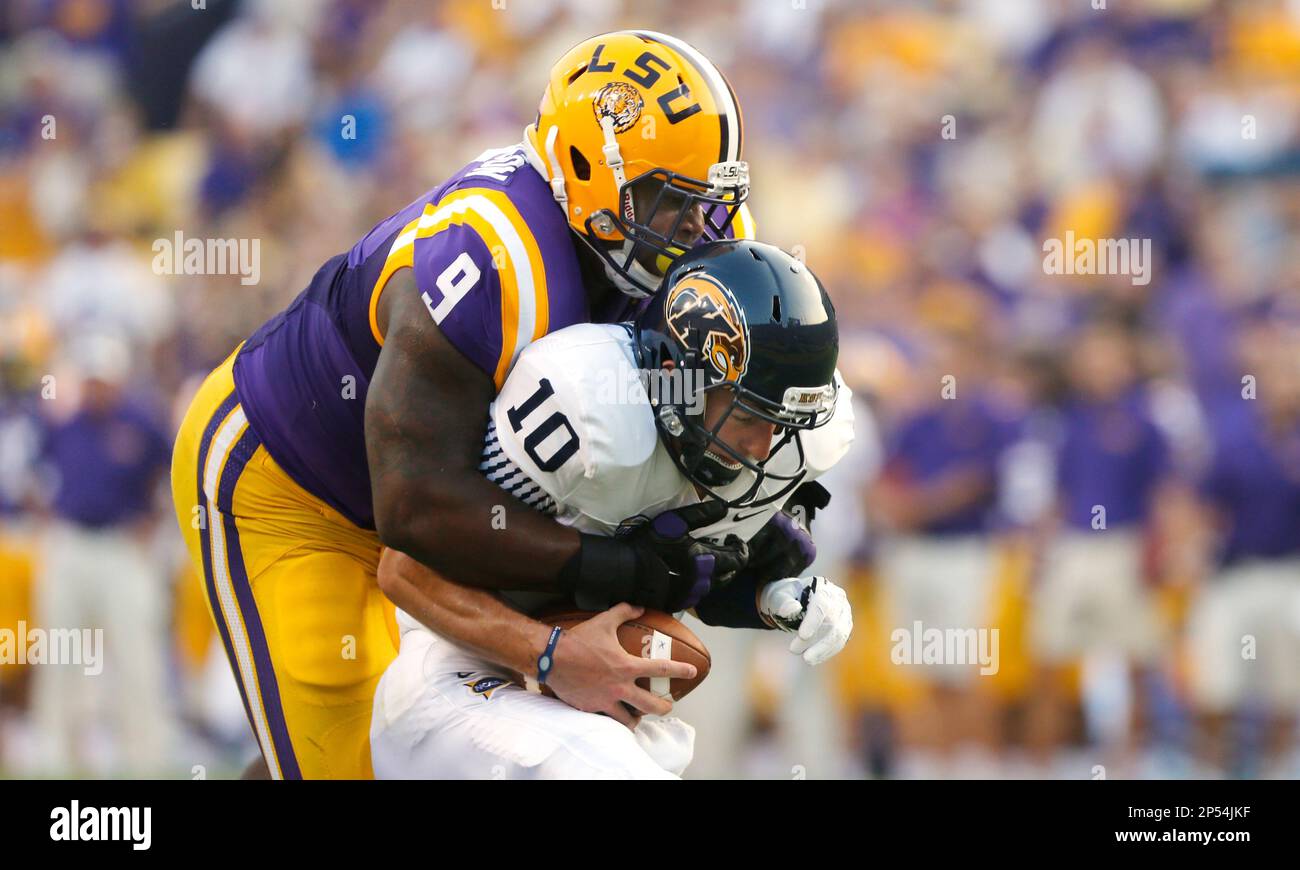 LSU Tigers defensive tackle Ego Ferguson (9) sacks Kent State Golden ...