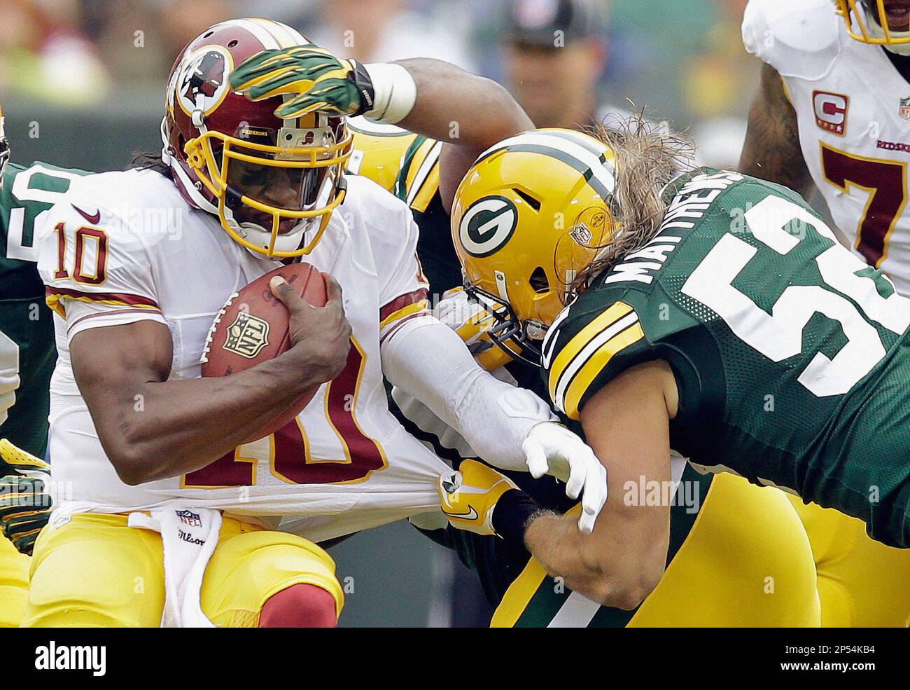 Washington Redskins quarterback Robert Griffin III (10) is sacked by ...