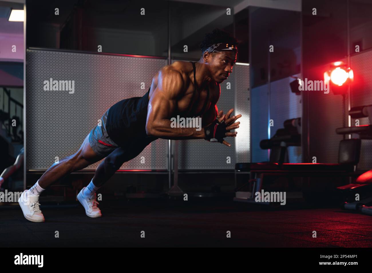 20s black male doing flying push ups in a gym Stock Photo - Alamy