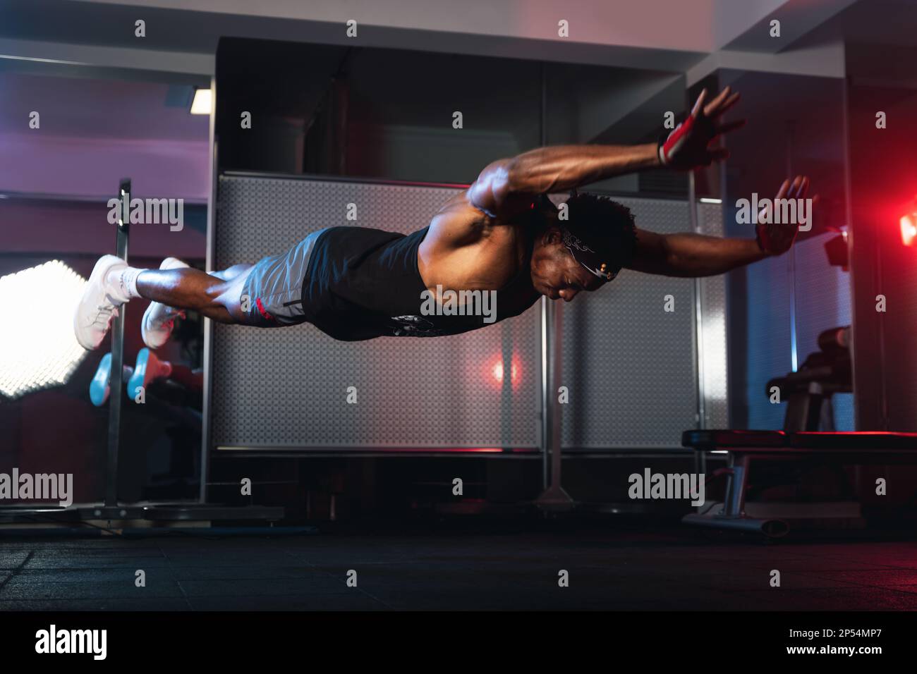 20s black male doing flying push ups in a gym Stock Photo - Alamy