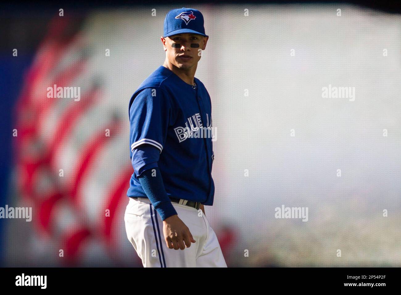 Toronto Blue Jays' Ryan Goins takes his place in the outfield during ...
