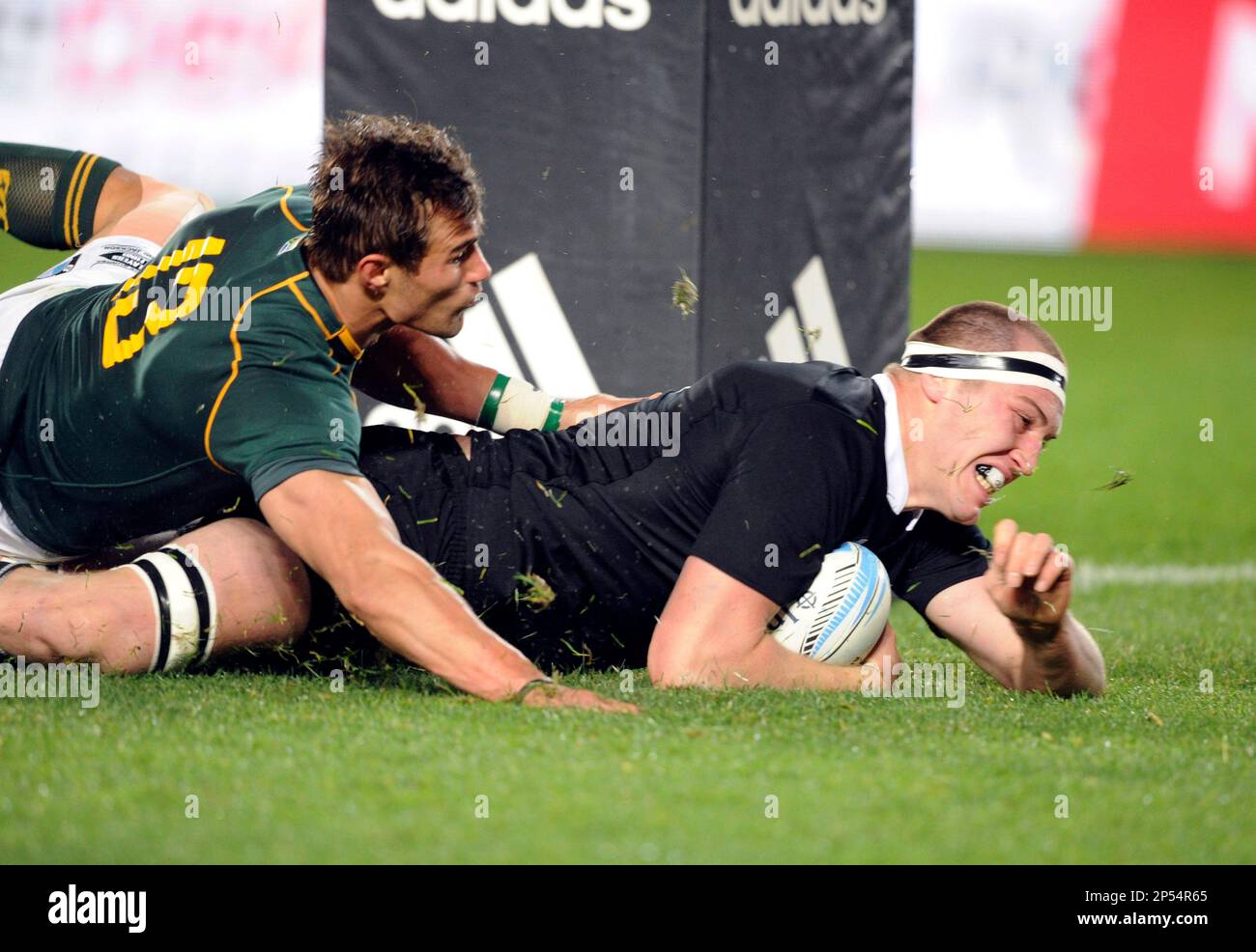 New Zealands' Brodie Retallikck dives into score in the tackle of South ...