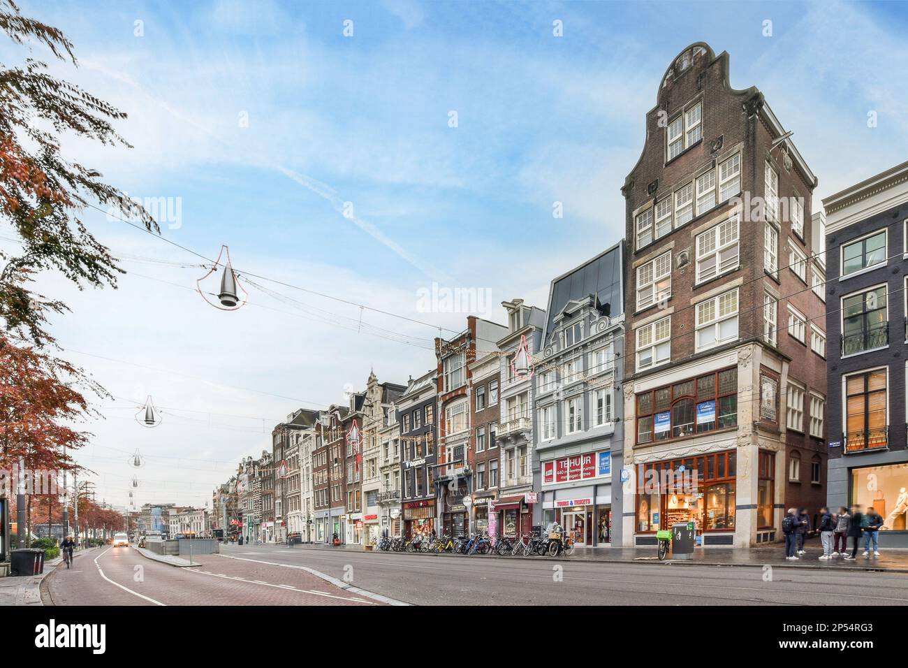 Amsterdam, Netherlands - 10 April, 2021: a city street with people ...