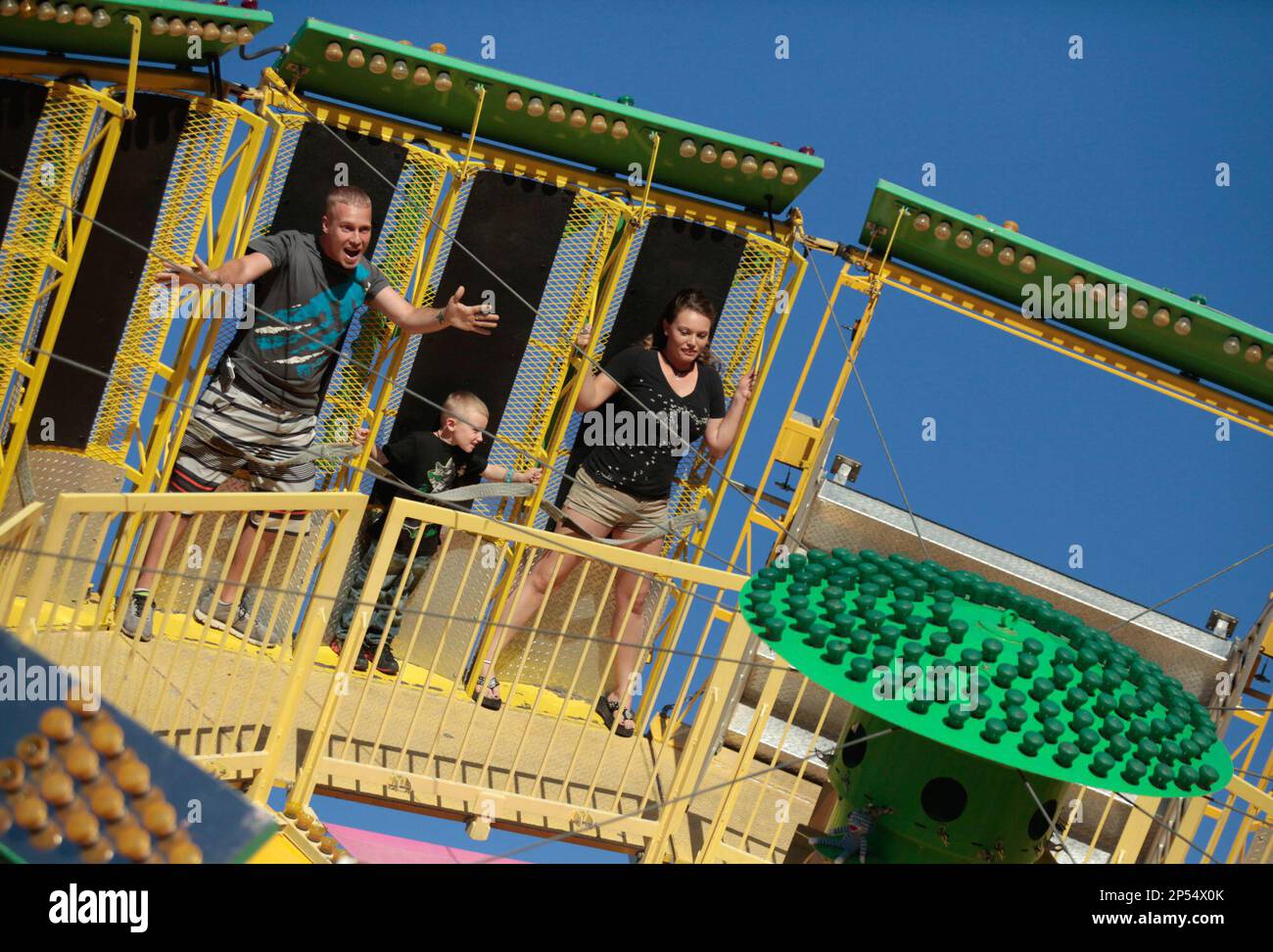 In this Sept. 9, 2013, photo, James Allen, left, cheers as he and his ...