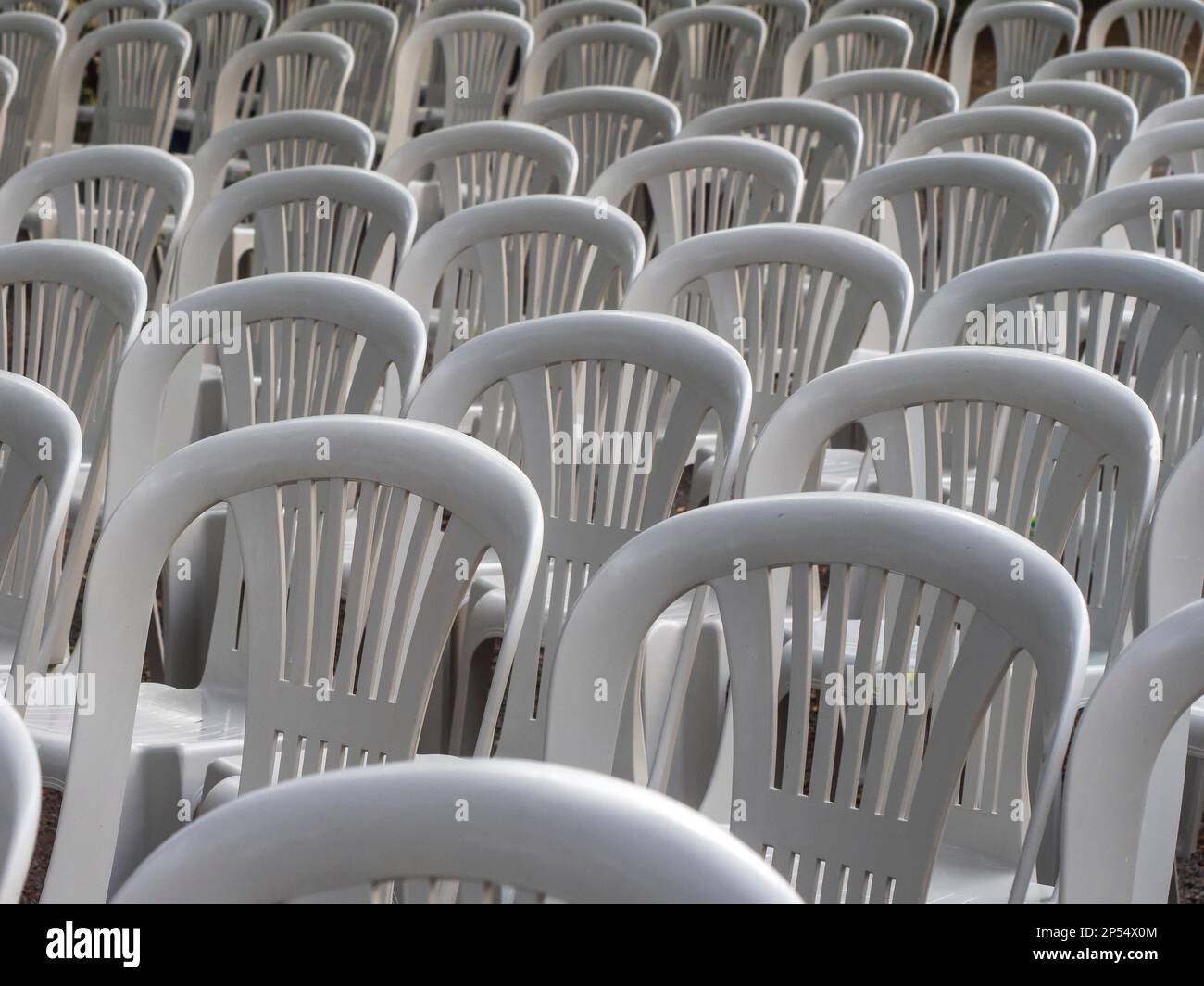 Row of plastic chairs hi-res stock photography and images - Alamy