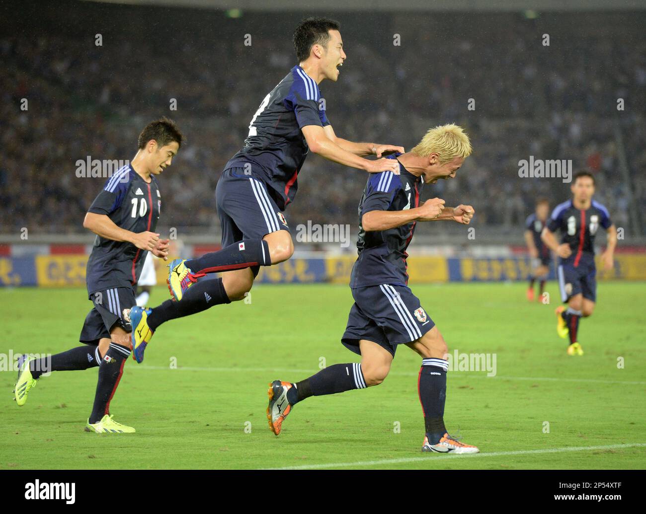 Japan's Keisuke Honda (front,R) celebrates with his teammates Shinji ...