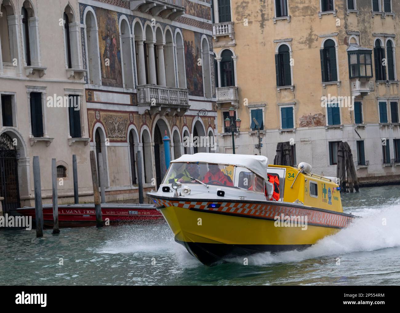 Water ambulance responding to an emergency travelling at speed through ...