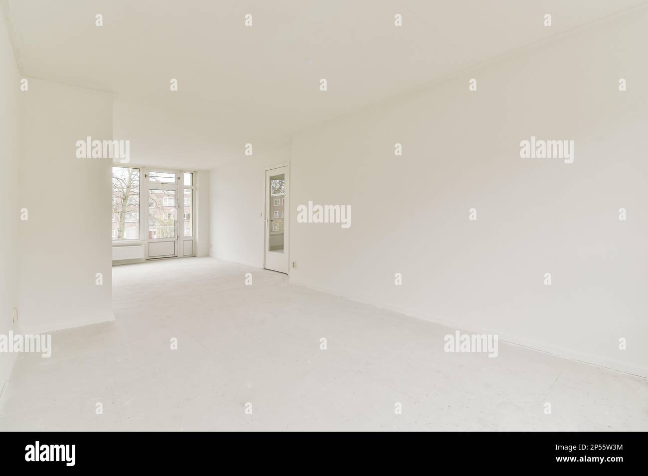 an empty room with white walls and no one person standing in the ...