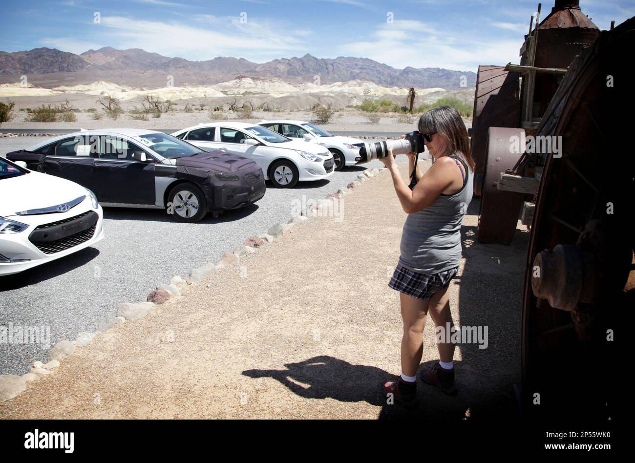 Brenda Priddy takes a photo of a vehicle in Death Valley National Park ...