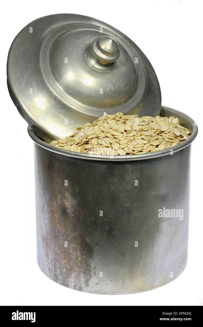 oatmeal in an aluminum jar isolated on white background Stock Photo - Alamy