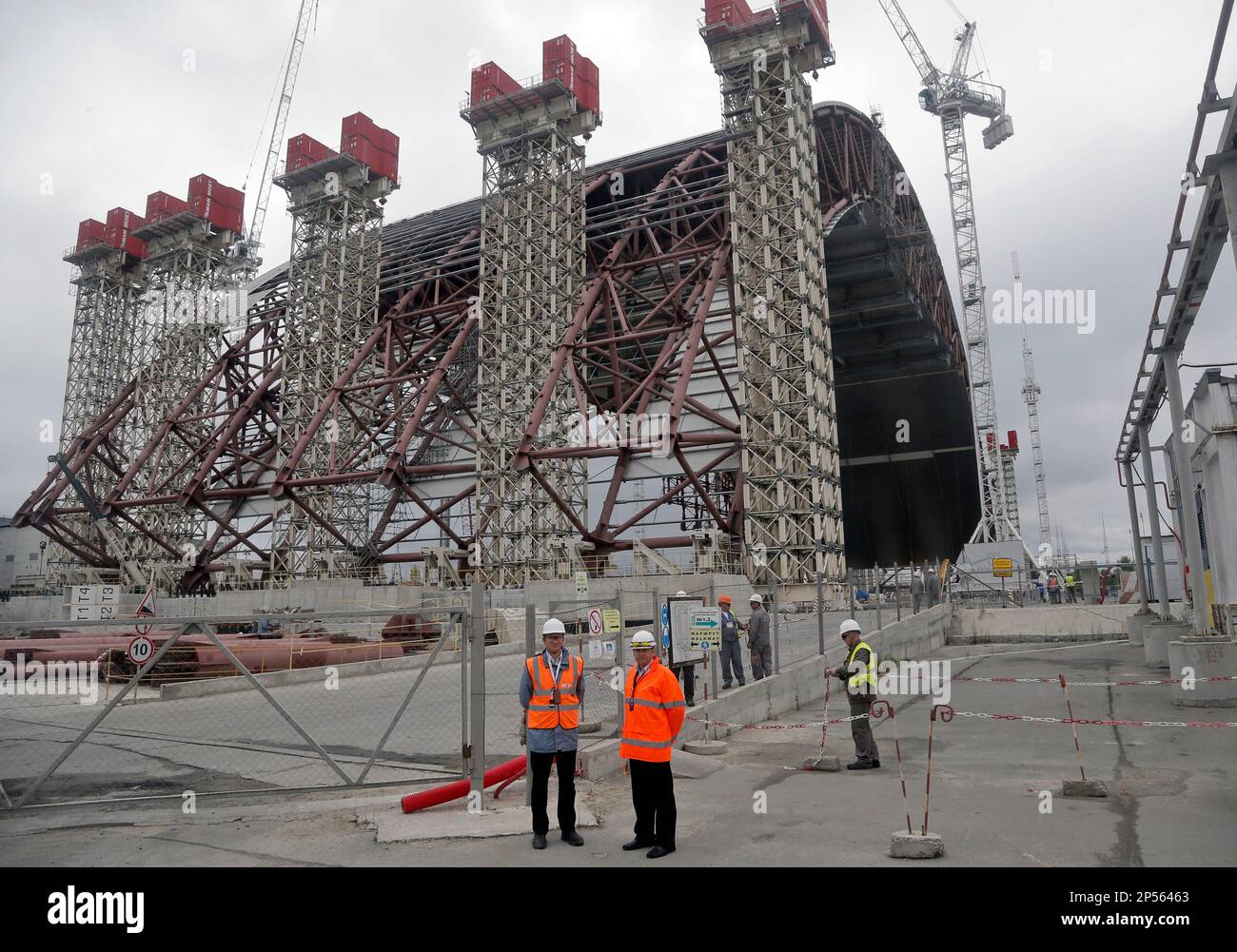 A gigantic steel arch under construction to cover the remnants of the ...