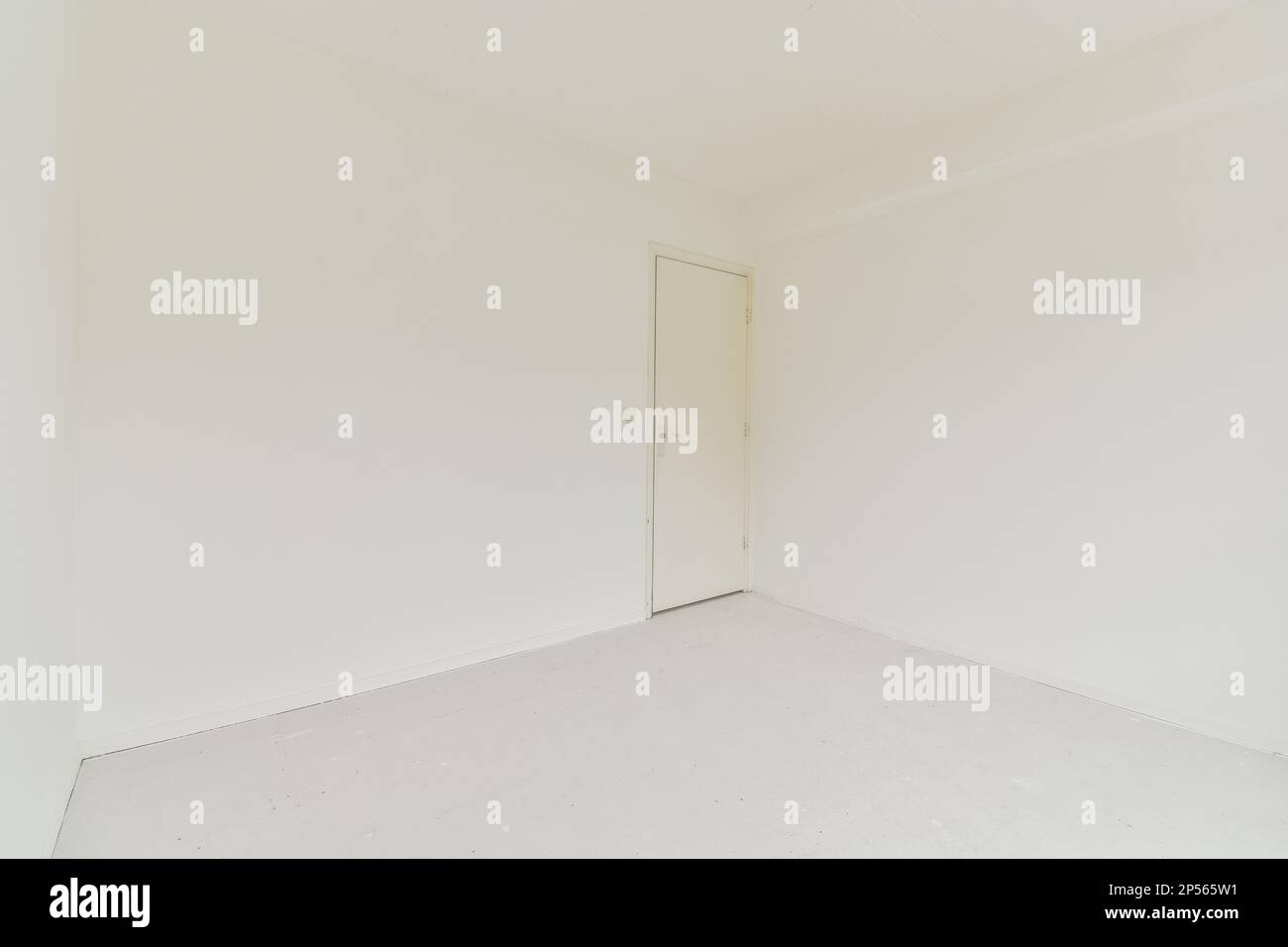 an empty room with white walls and no one door on the right side, there ...