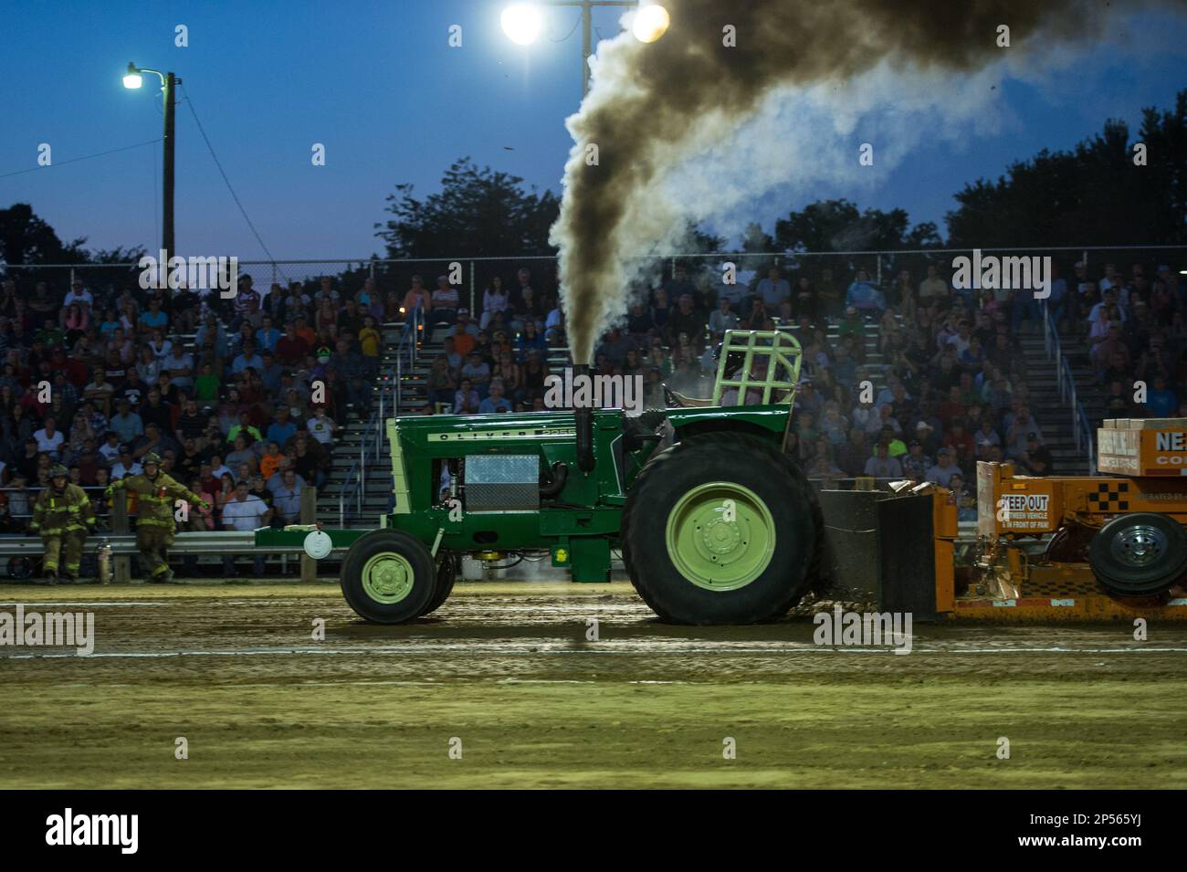 Contestants take part in the tractor pull at the Chelsea Community Fair ...