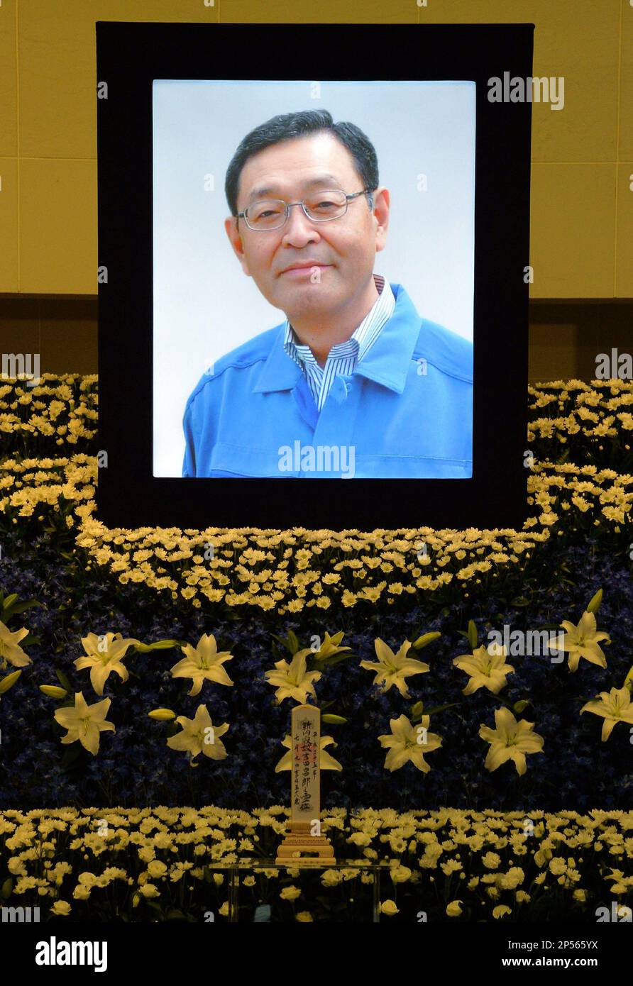 A photograph of Masao Yoshida is displayed at a memorial service held ...