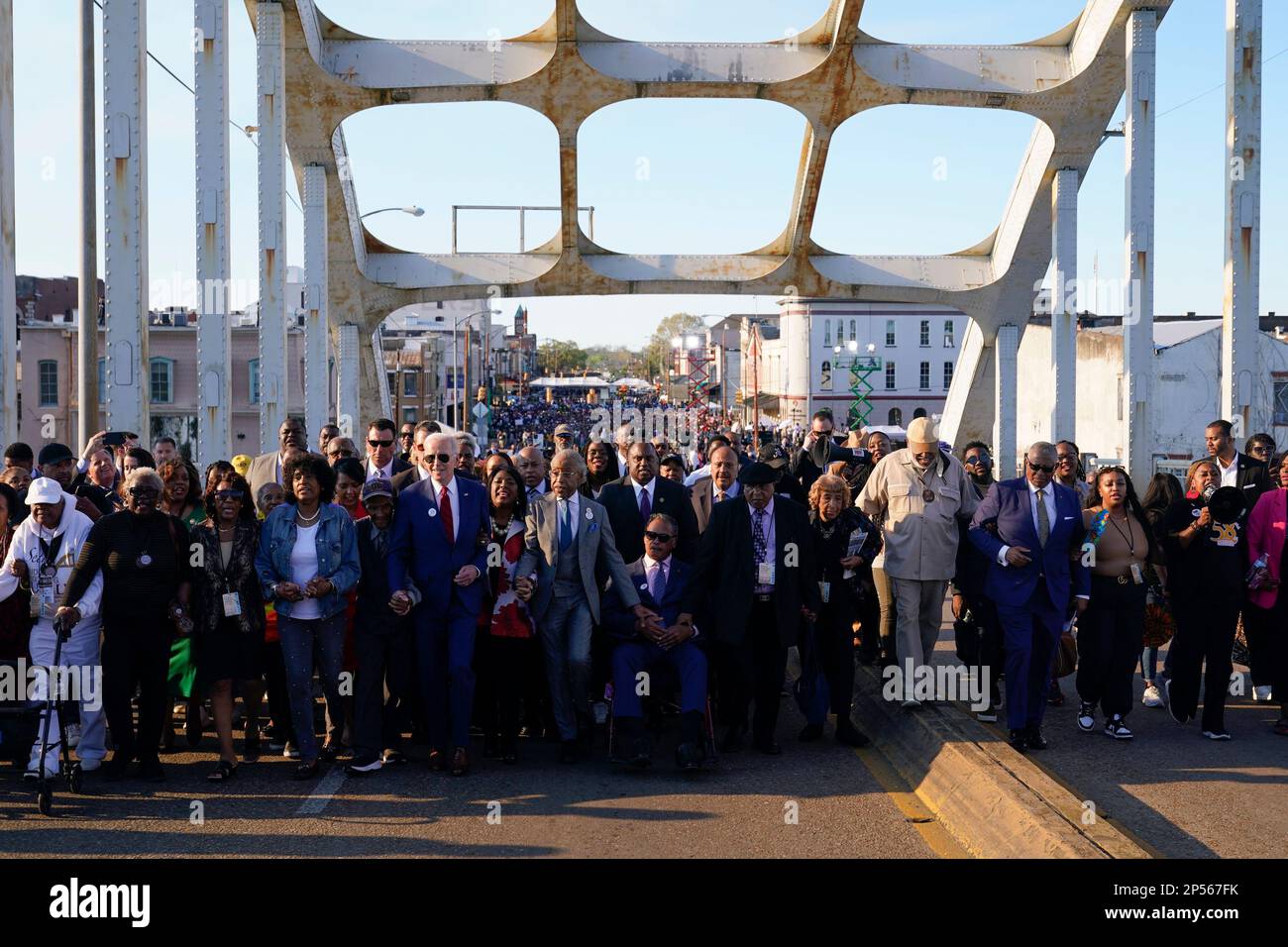 President Joe Biden walks across the Edmund Pettus Bridge in Selma, Ala ...