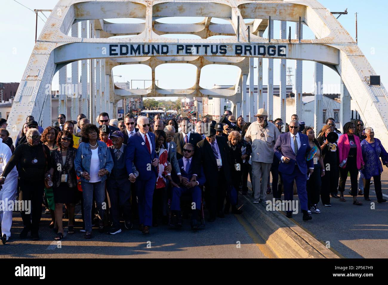 President Joe Biden walks across the Edmund Pettus Bridge in Selma, Ala ...