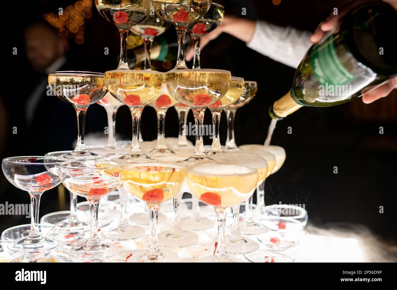 Champagne glasses standing in a tower at the wedding party. Champagne ...