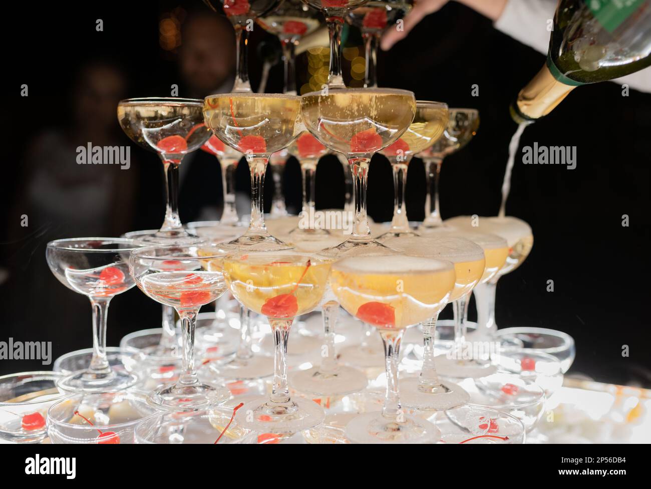 Champagne glasses standing in a tower at the wedding party. Champagne ...