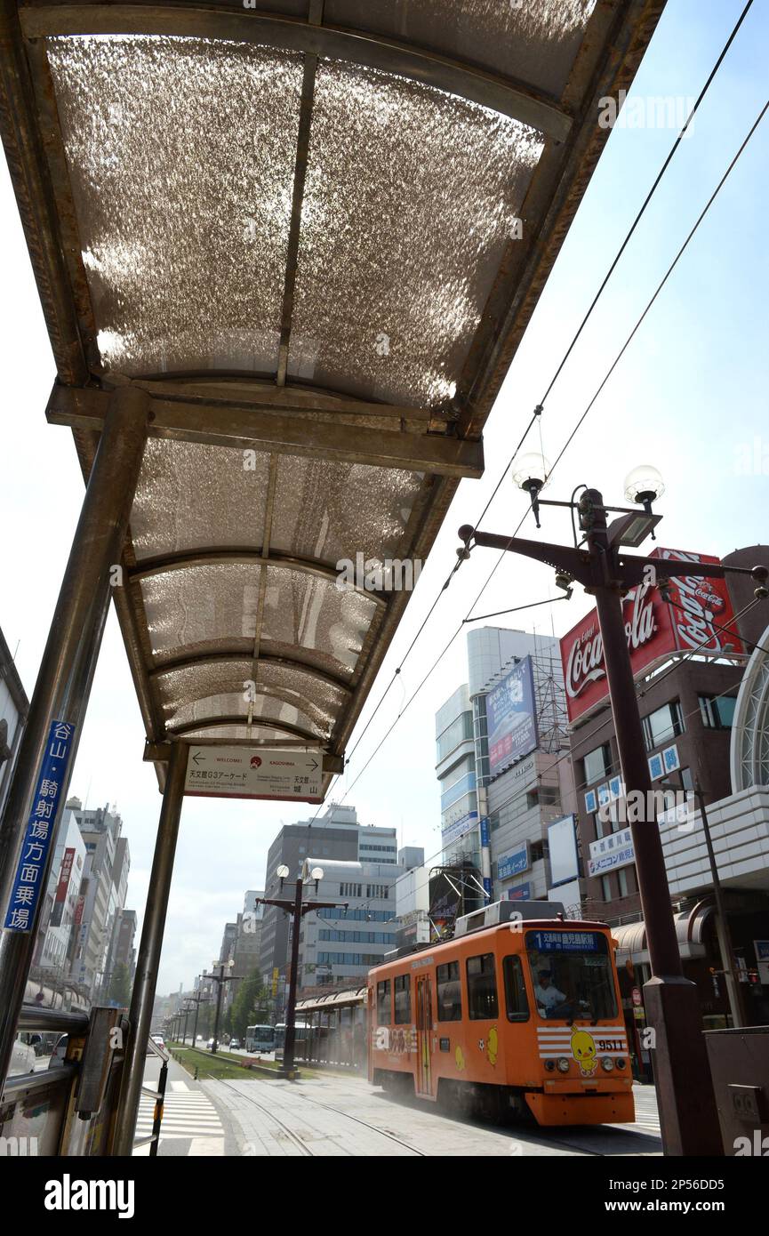 A photo shows a roof of bus stop covered with gray ash from the ...