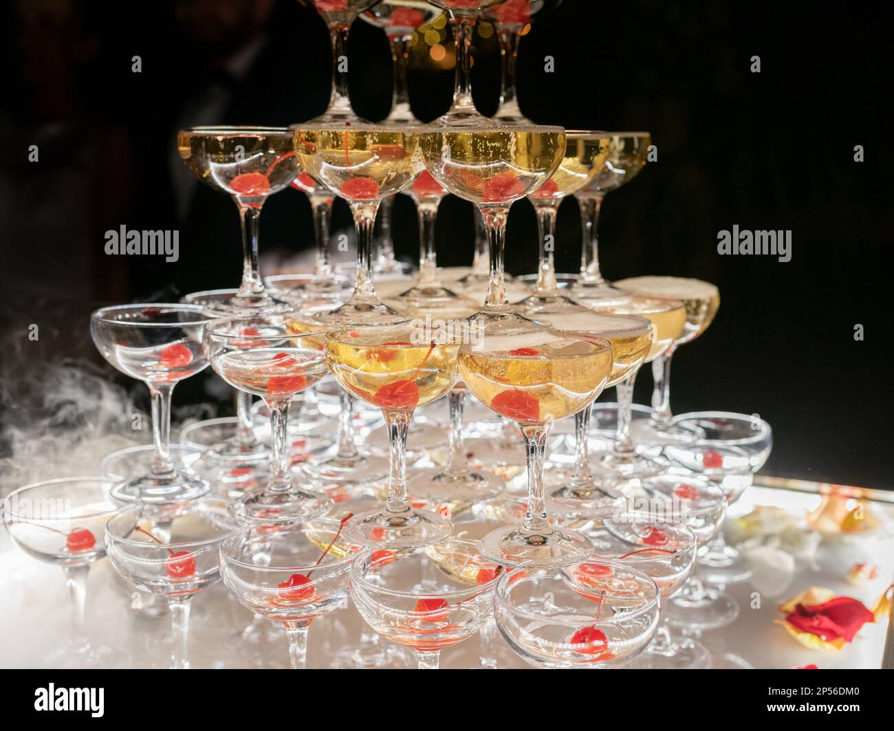 Champagne glasses standing in a tower at the wedding party. Champagne ...
