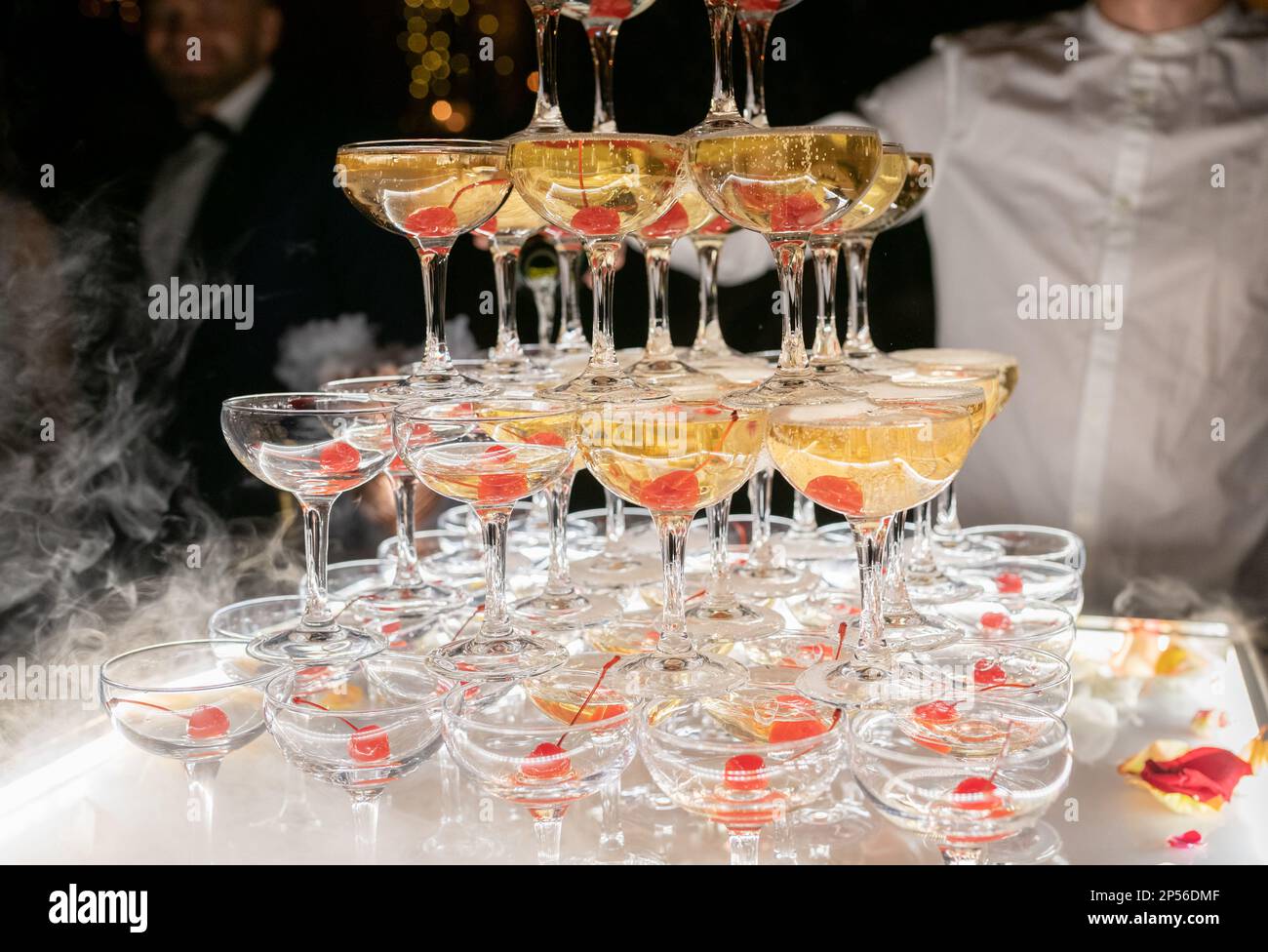 Champagne glasses standing in a tower at the wedding party. Champagne ...