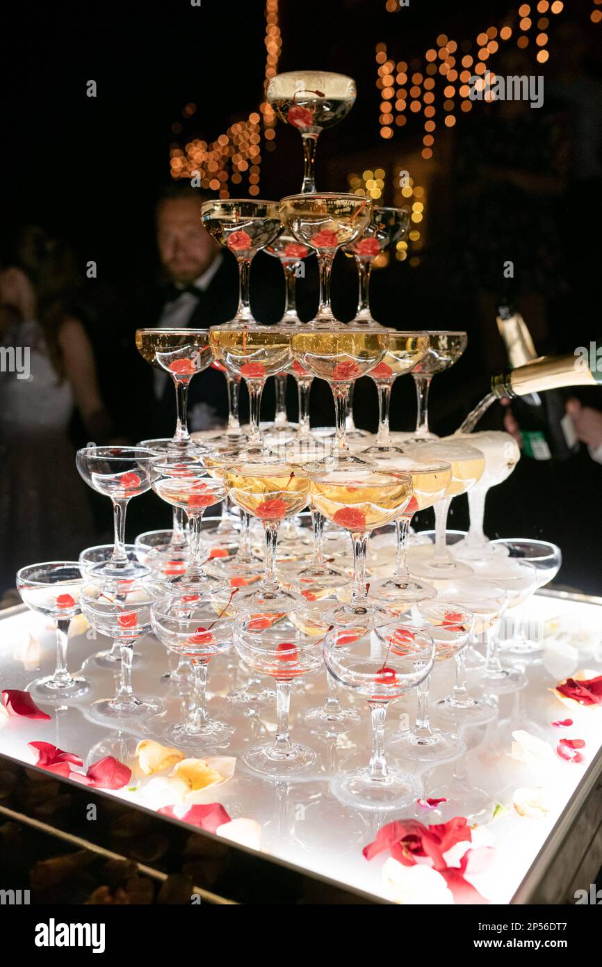 Champagne glasses standing in a tower at the wedding party. Champagne ...
