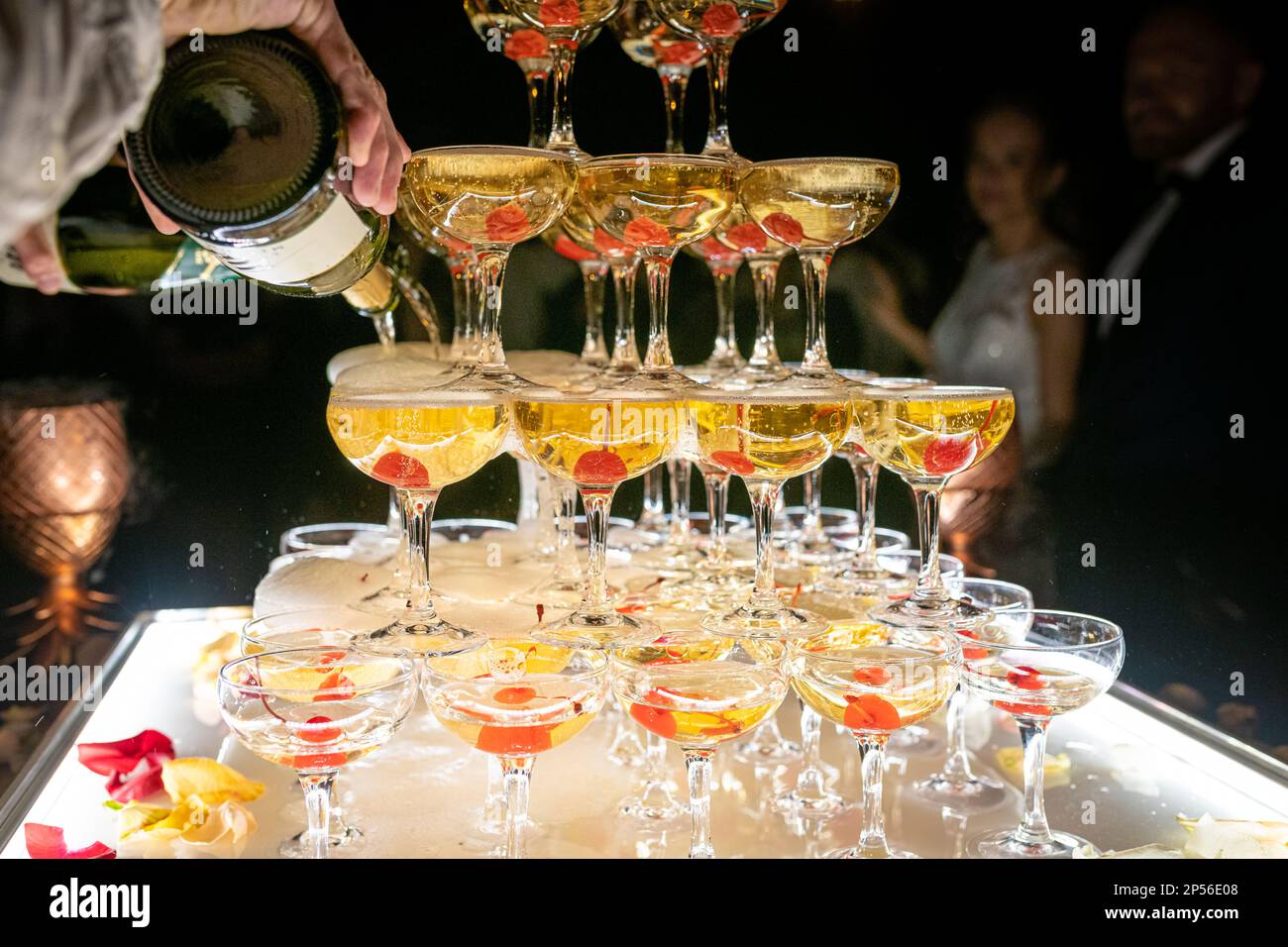 Champagne glasses standing in a tower at the wedding party. Champagne ...