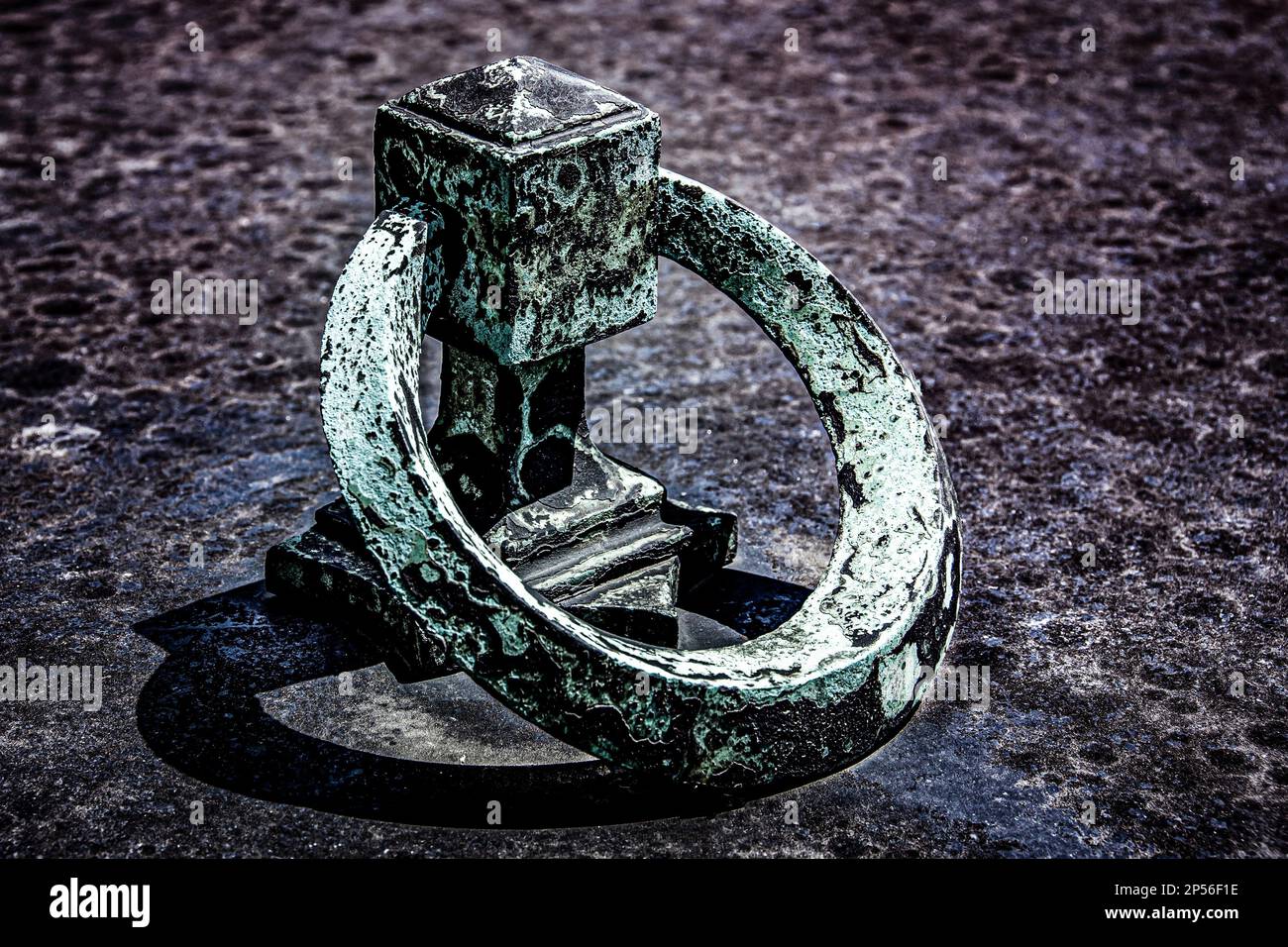 Old green patinated metal handle on mossy stone Stock Photo - Alamy