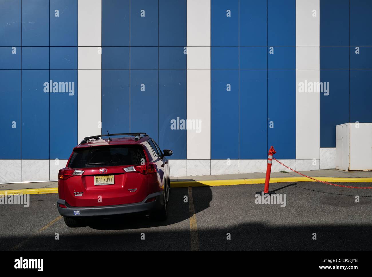 Red car in a parking lot, Jersey City, NJ Stock Photo - Alamy