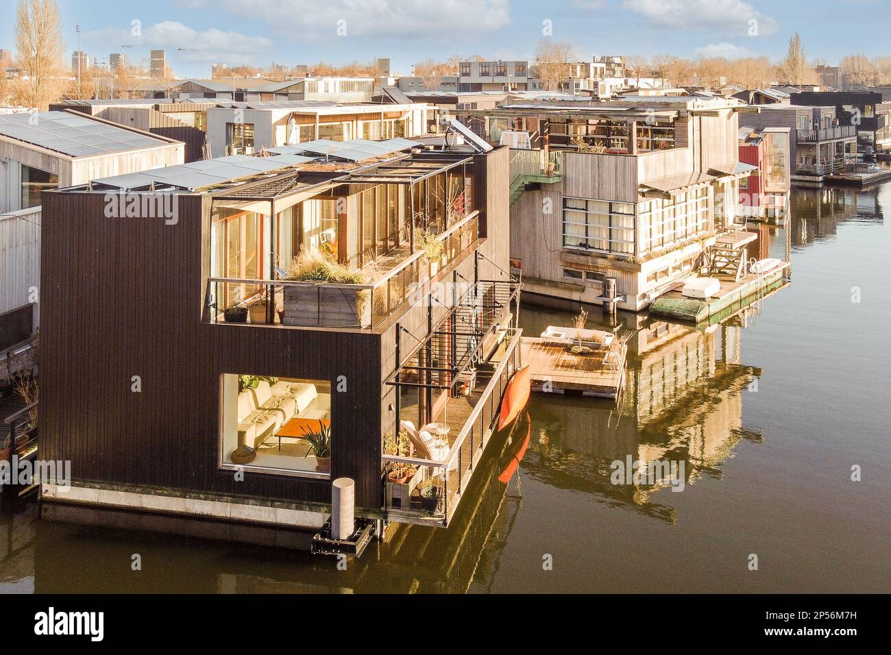 some houses that are floating in the water, and one is on the other ...