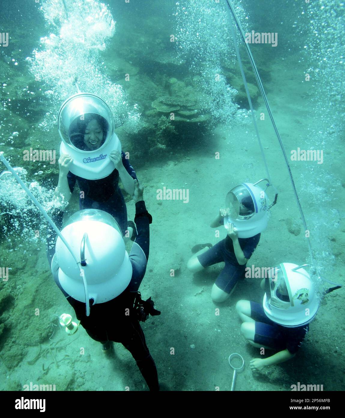 Visitors, who wear the Seawalker Diving Helmet System and Equipment ...