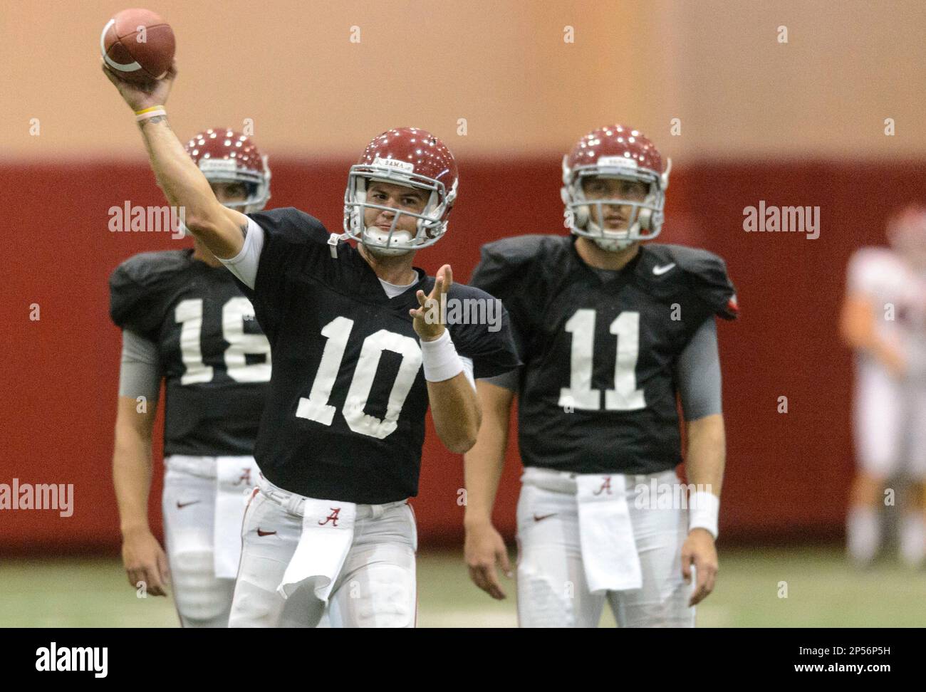 Alabama quarterback AJ McCarron (10) throws during passing drills ...