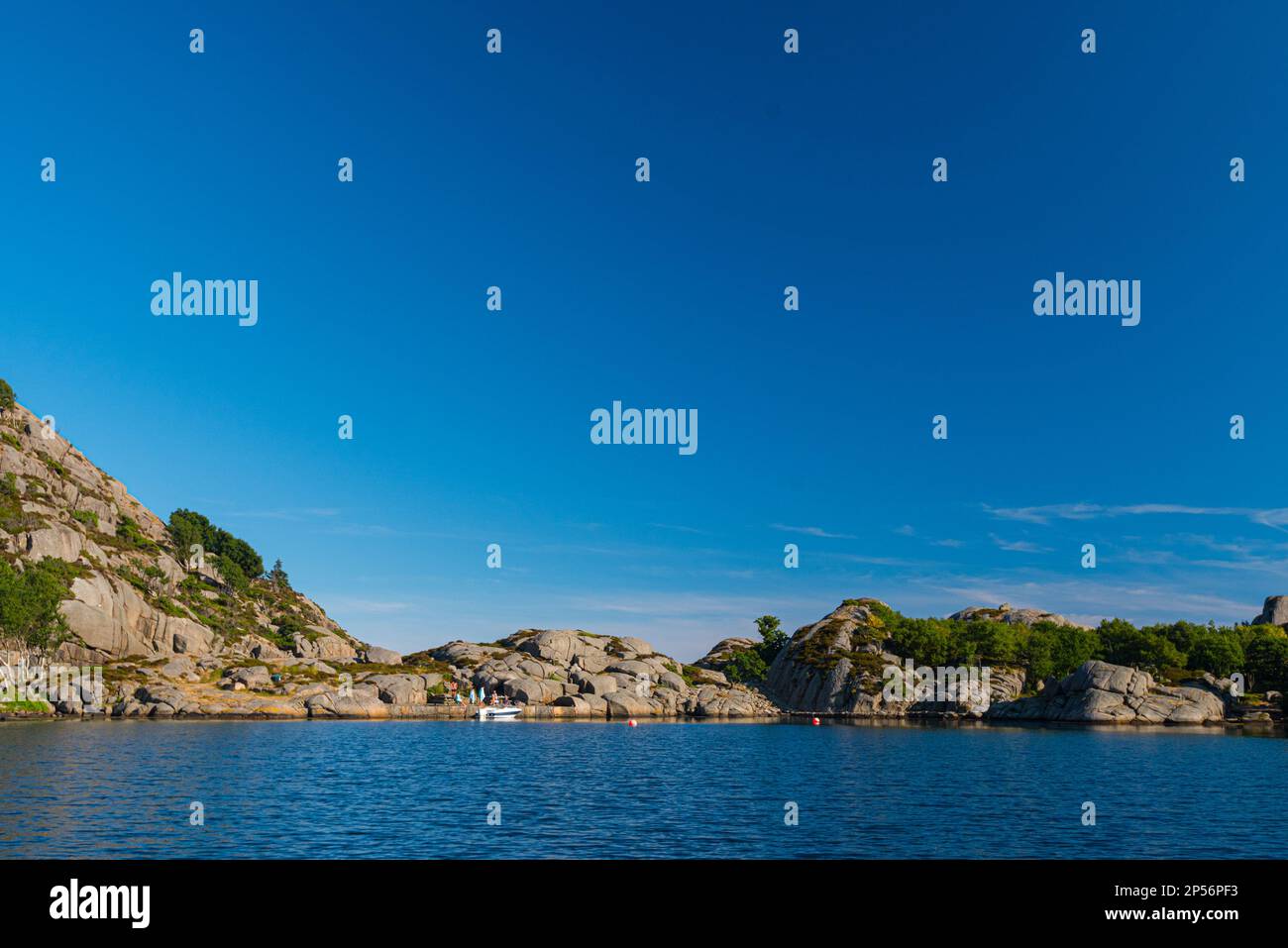 Sunny cliffs. People drying up after simming Stock Photo - Alamy
