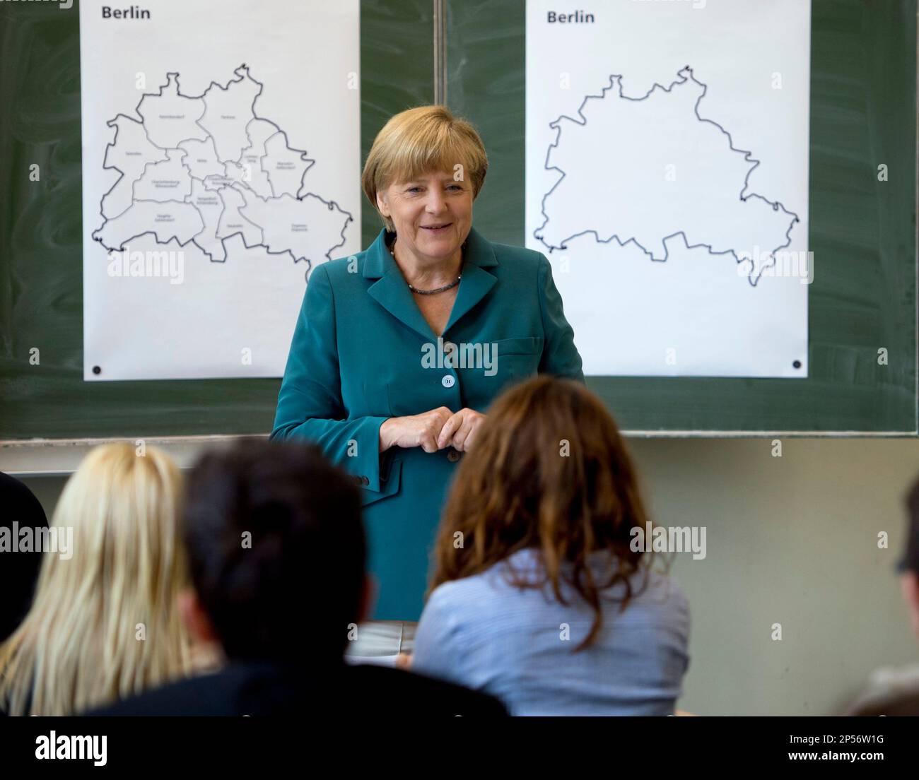 German Chancellor Angela Merkel smiles as she lectures on the building of the Berlin Wall Aug ...