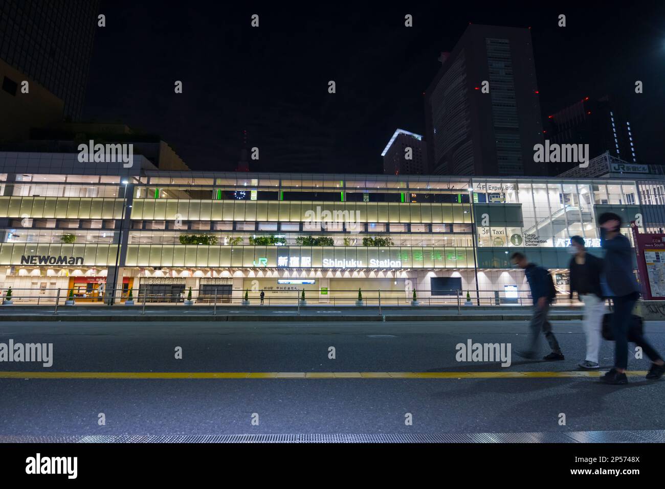 Shinjuku Station glows in the midnight in Shinjuku, Tokyo, Japan Stock ...