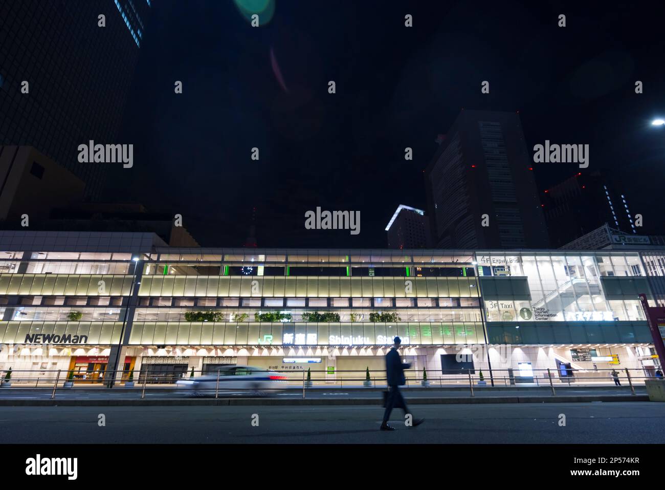 Shinjuku Station glows in the midnight in Shinjuku, Tokyo, Japan Stock ...