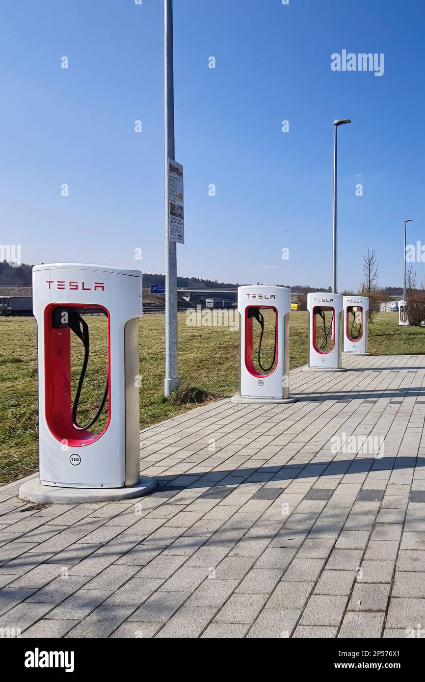 parking with tesla chargers Stock Photo - Alamy