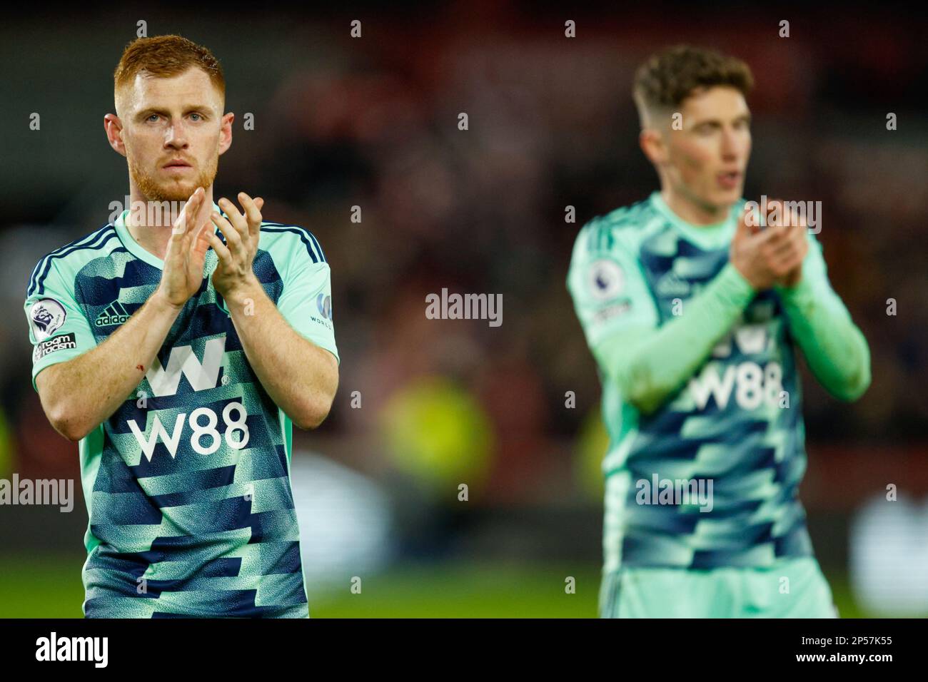 Fulham's Harrison Reed, left, reacts as he walks from the pitch ...
