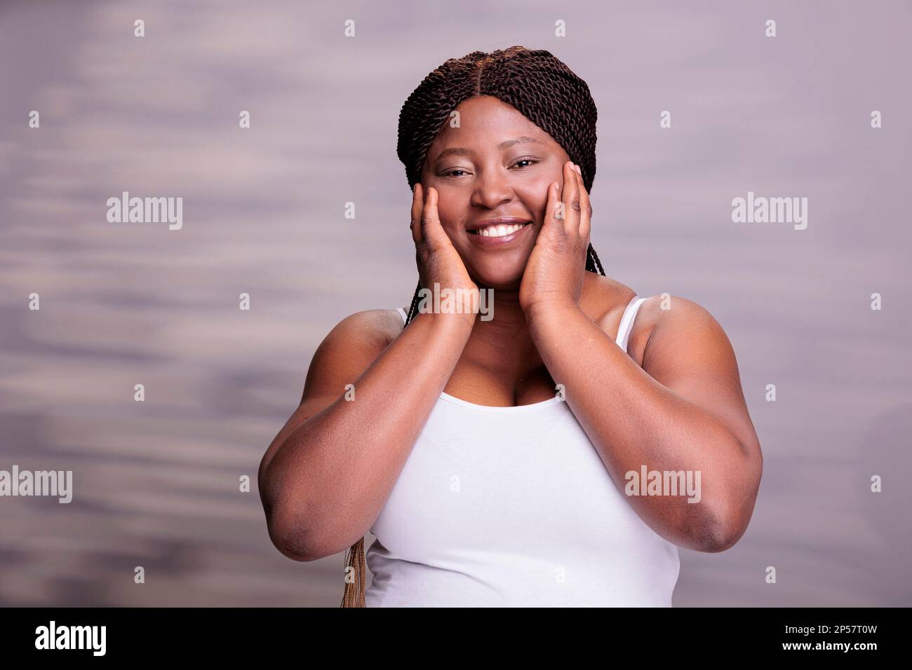 Smiling plus size woman making face washing gesture portrait. Happy ...