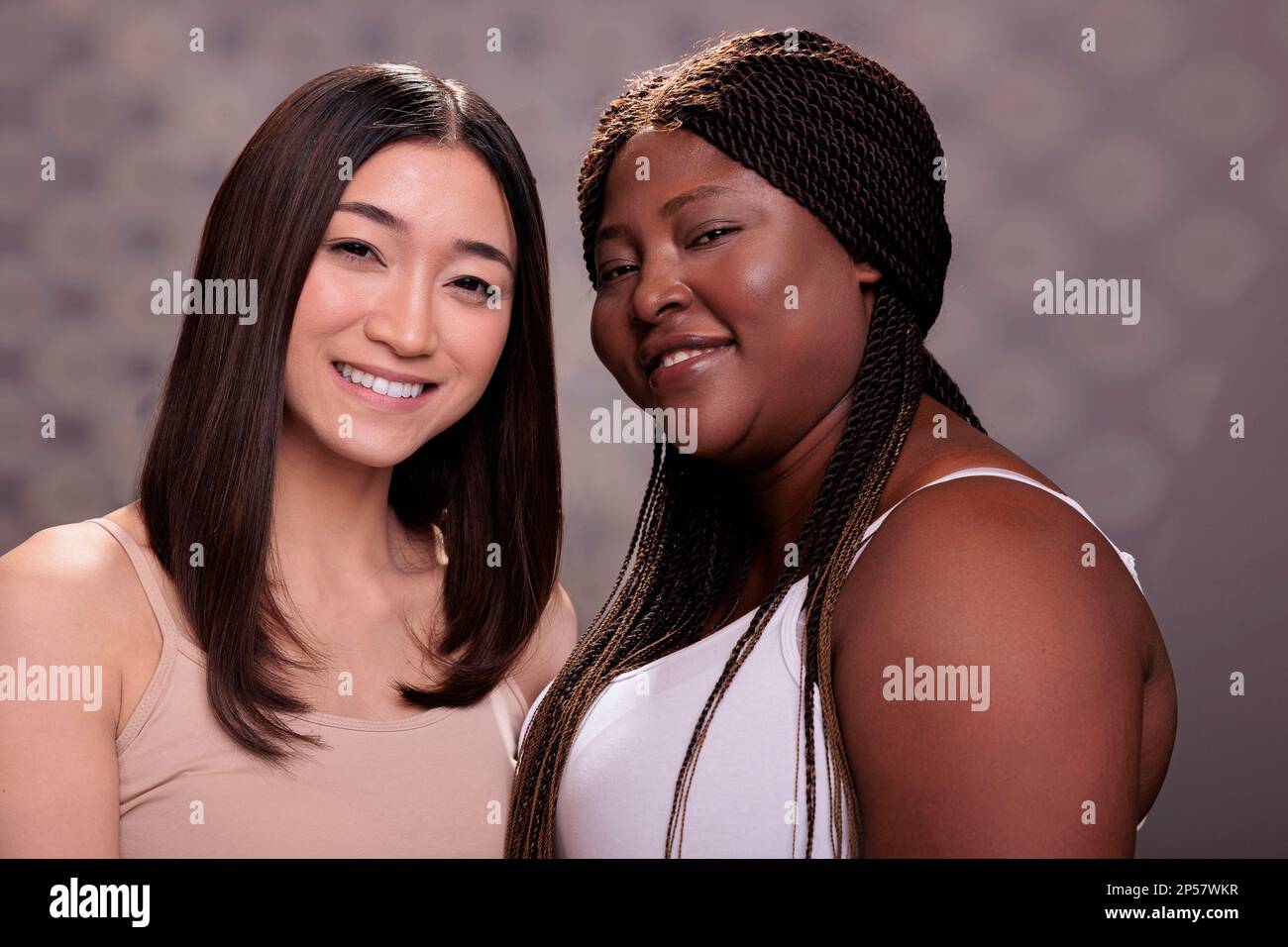 Diverse smiling cheerful beauty models looking at camera with positive ...